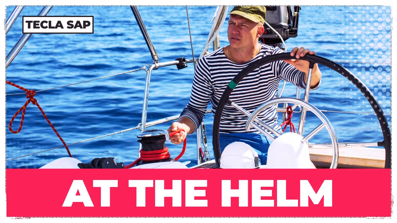 AT THE HELM? Qual é o significado e a tradução da expressão?